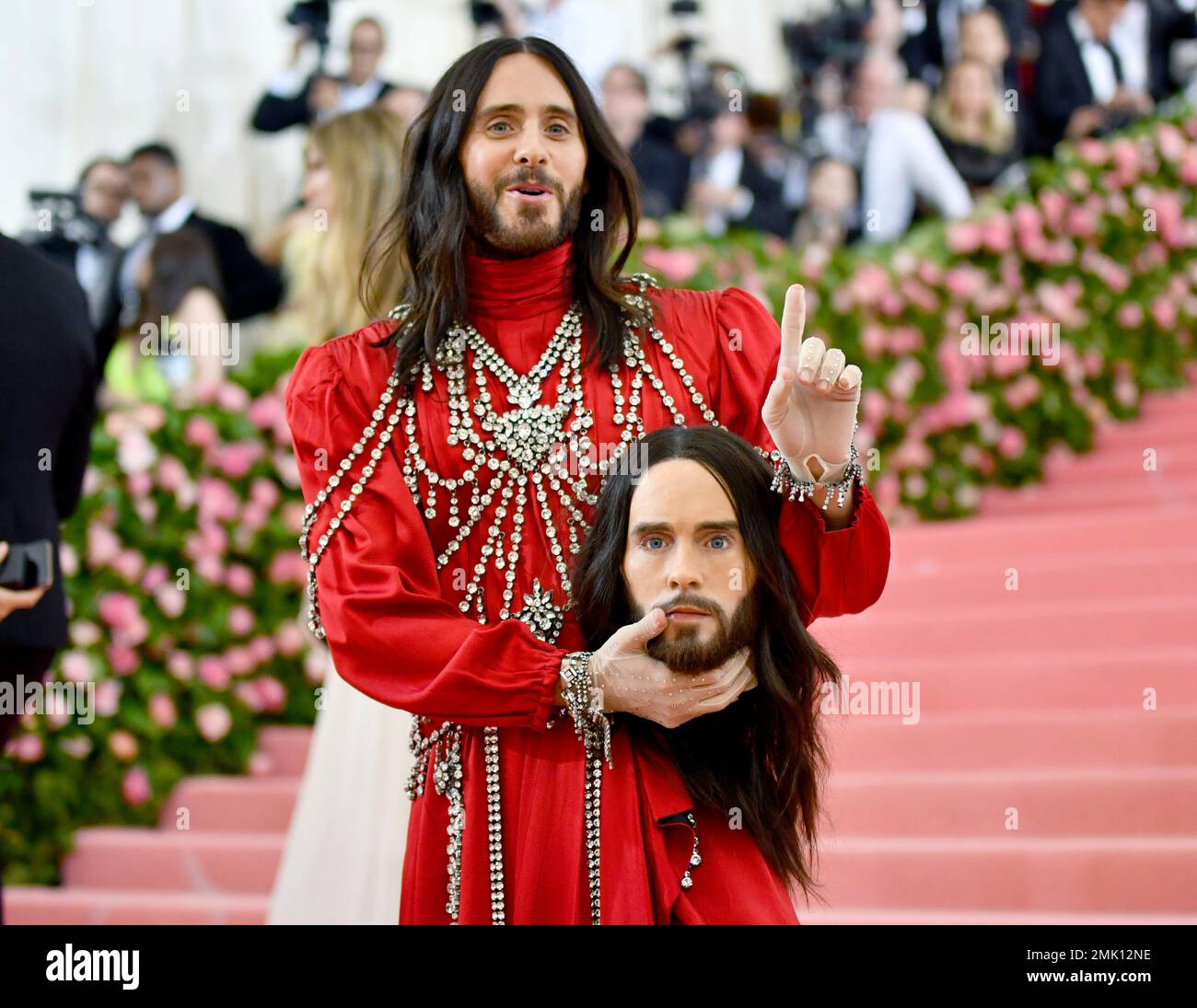 Jared Leto, holding a model of his head, attends The Metropolitan ...