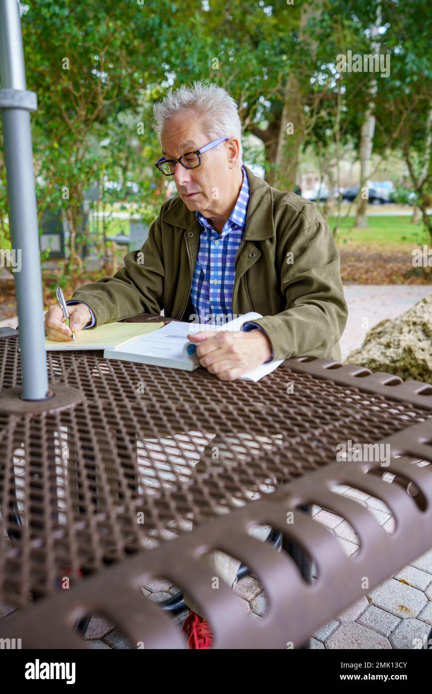 Elderly man professor sitting hi-res stock photography and images - Alamy