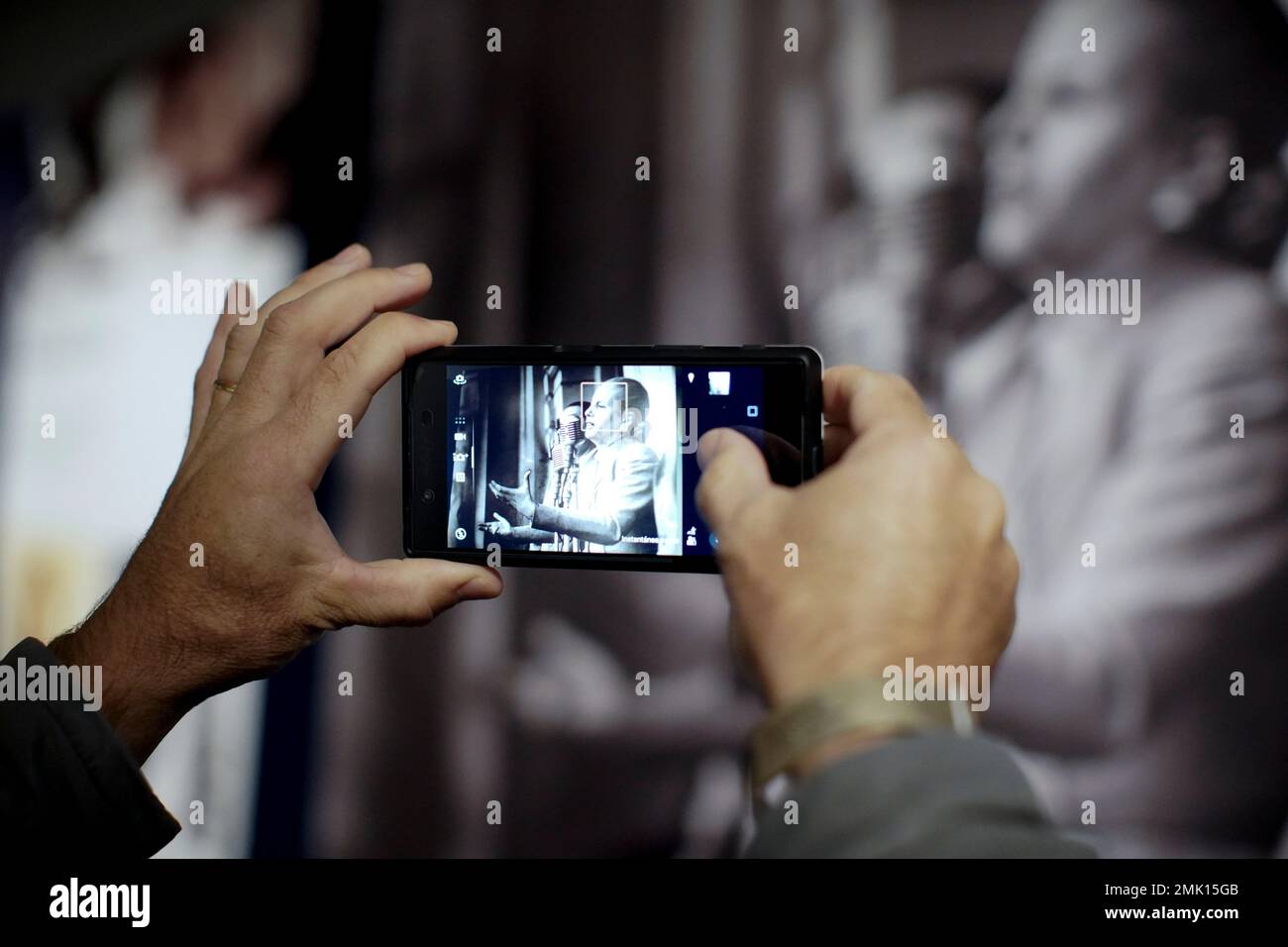 A visitor takes a picture of a poster of Eva Peron inside her home ...