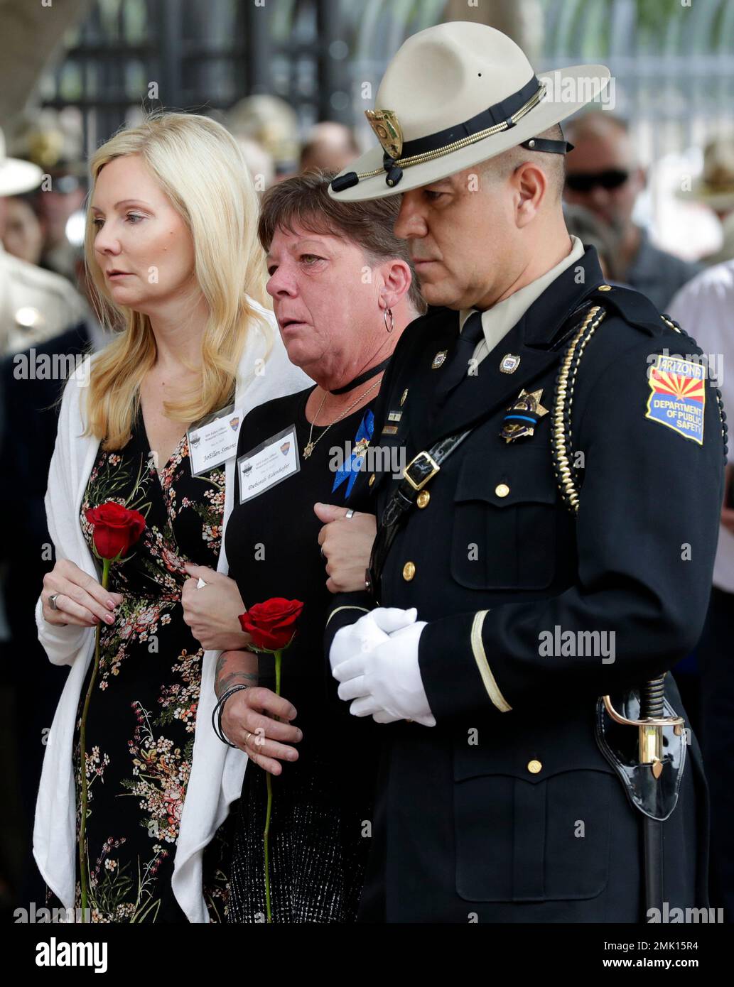 Deborah Edenhofer, center, mother of Tyler Edenhofer, prepares to place ...