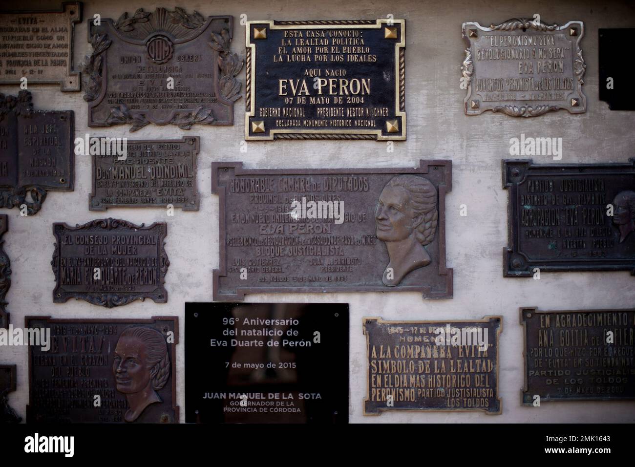Plaques recognizing Eva Perón cover a wall inside her home-turned ...
