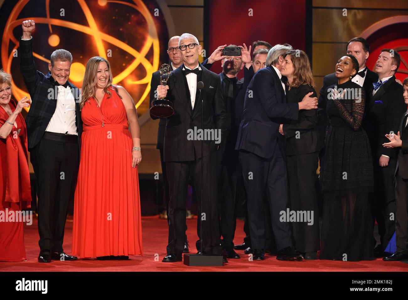Michael Slade, center, and the cast and crew of "After Forever" accept ...