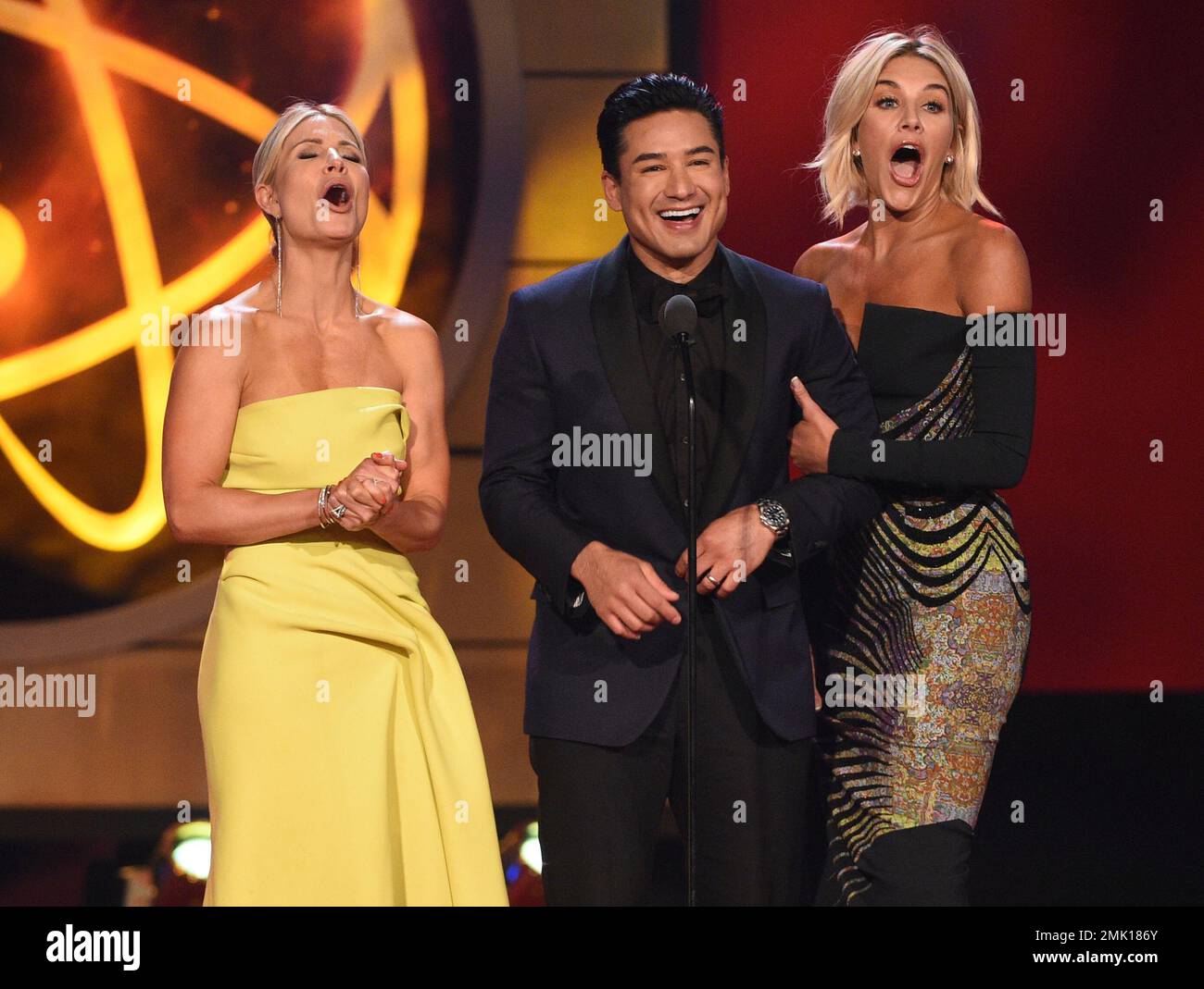 Dayna Devon, from left, Mario Lopez and Charissa Thompson present a ...