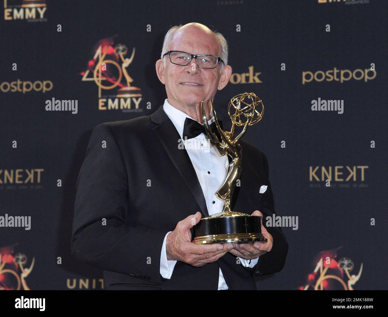 Max Gail poses in the press room with the award for outstanding ...