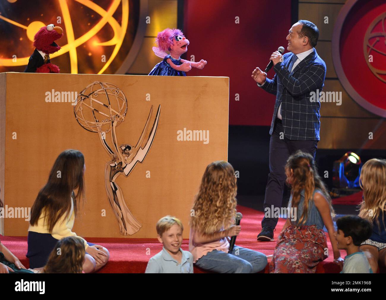 Alan Muraoka, right, performs with Muppets Elmo and Abby Cadabby at the ...
