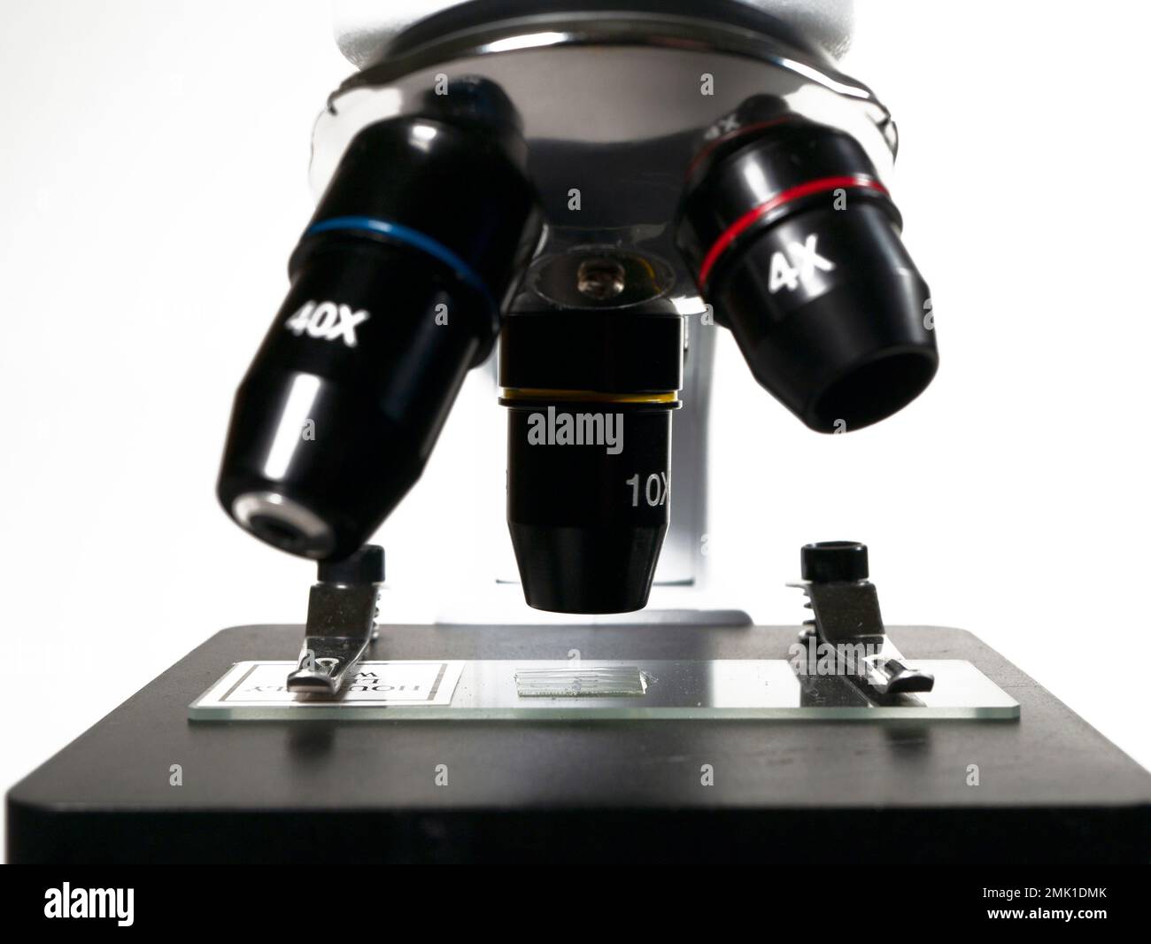 Microscope close-up. Examination of a micro sample on a glass slide ...