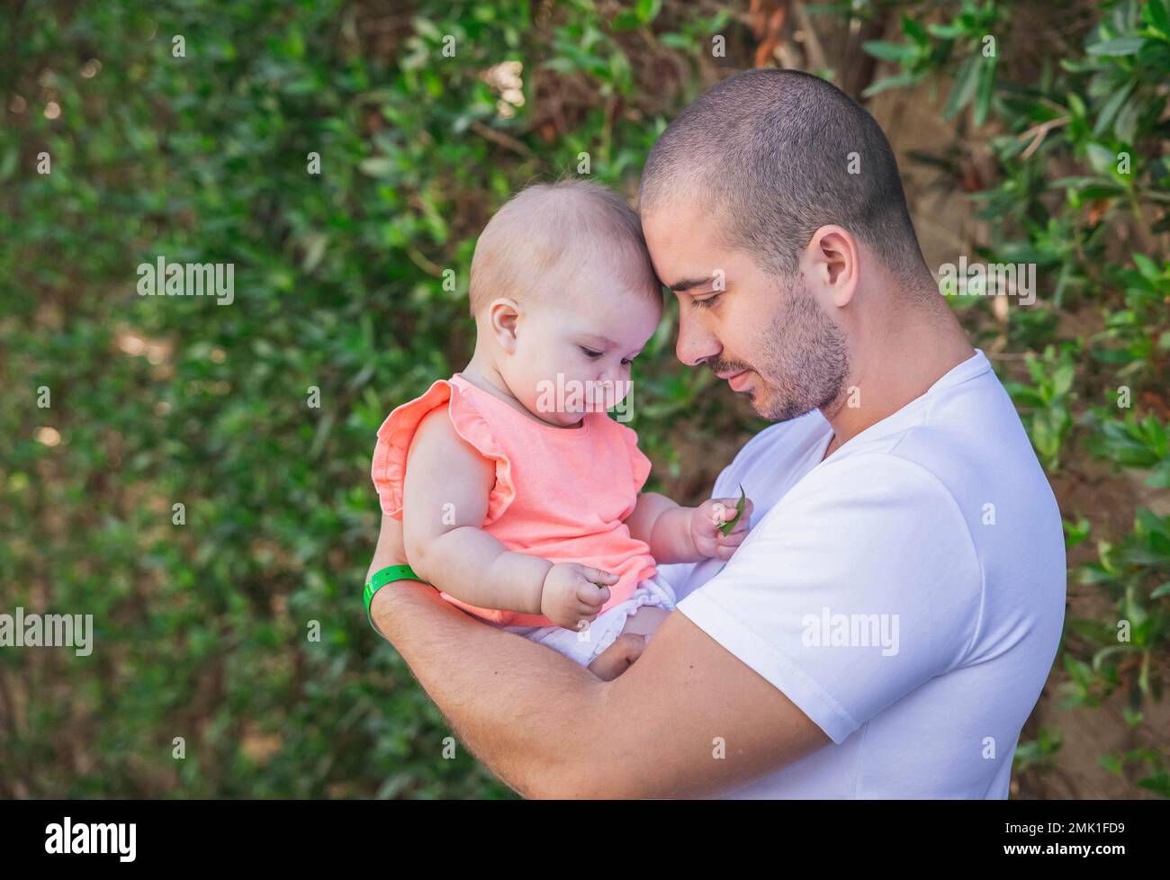 father and daughter leaned their heads to each other Stock Photo - Alamy