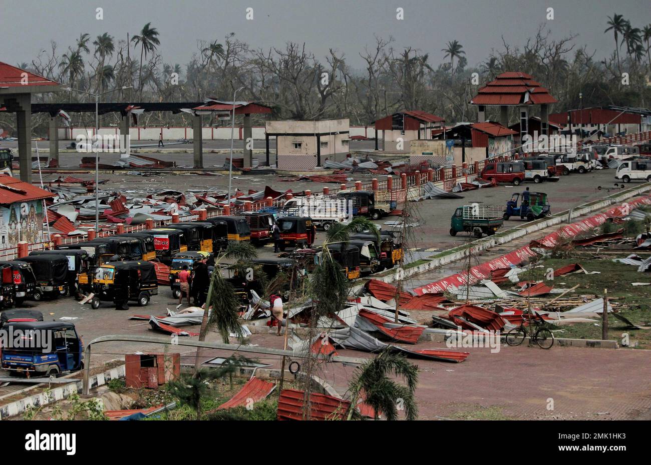 Corrugated sheets used as roofing lie scattered after Cyclone Fani made ...