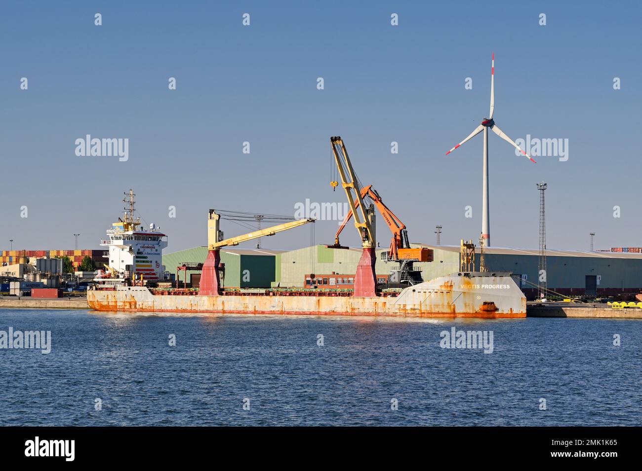 Antwerp, Belgium - August 2022: Cargo ship Vectis Progress surrounded by cranes being unloaded ...