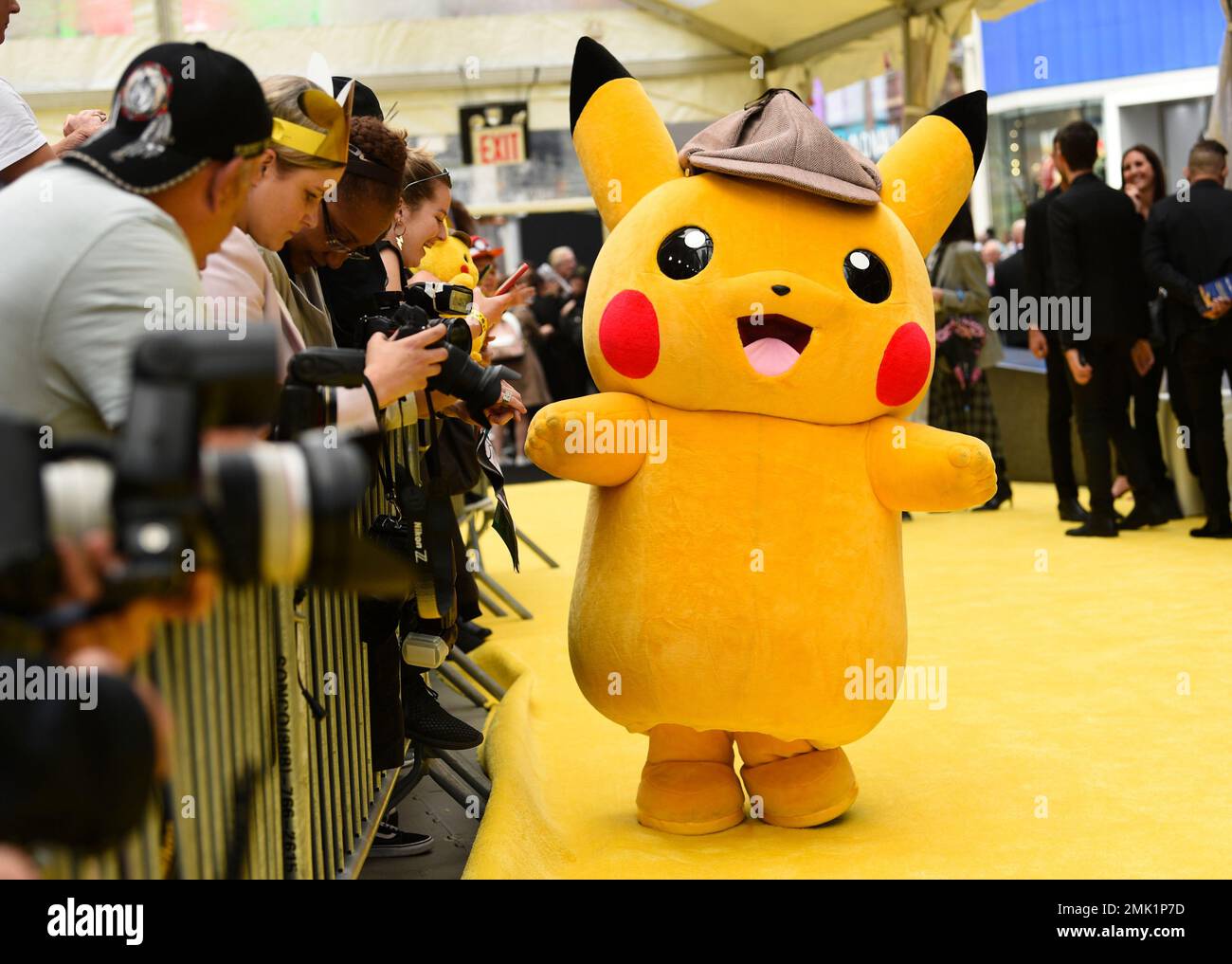 A person in a Pikachu character costume attends the premiere of ...