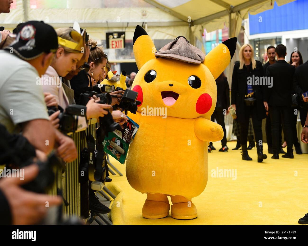 A person in a Pikachu character costume attends the premiere of ...