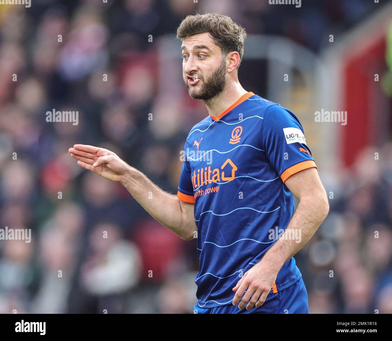 Charlie Goode #27 of Blackpool gives his team instructions during the ...