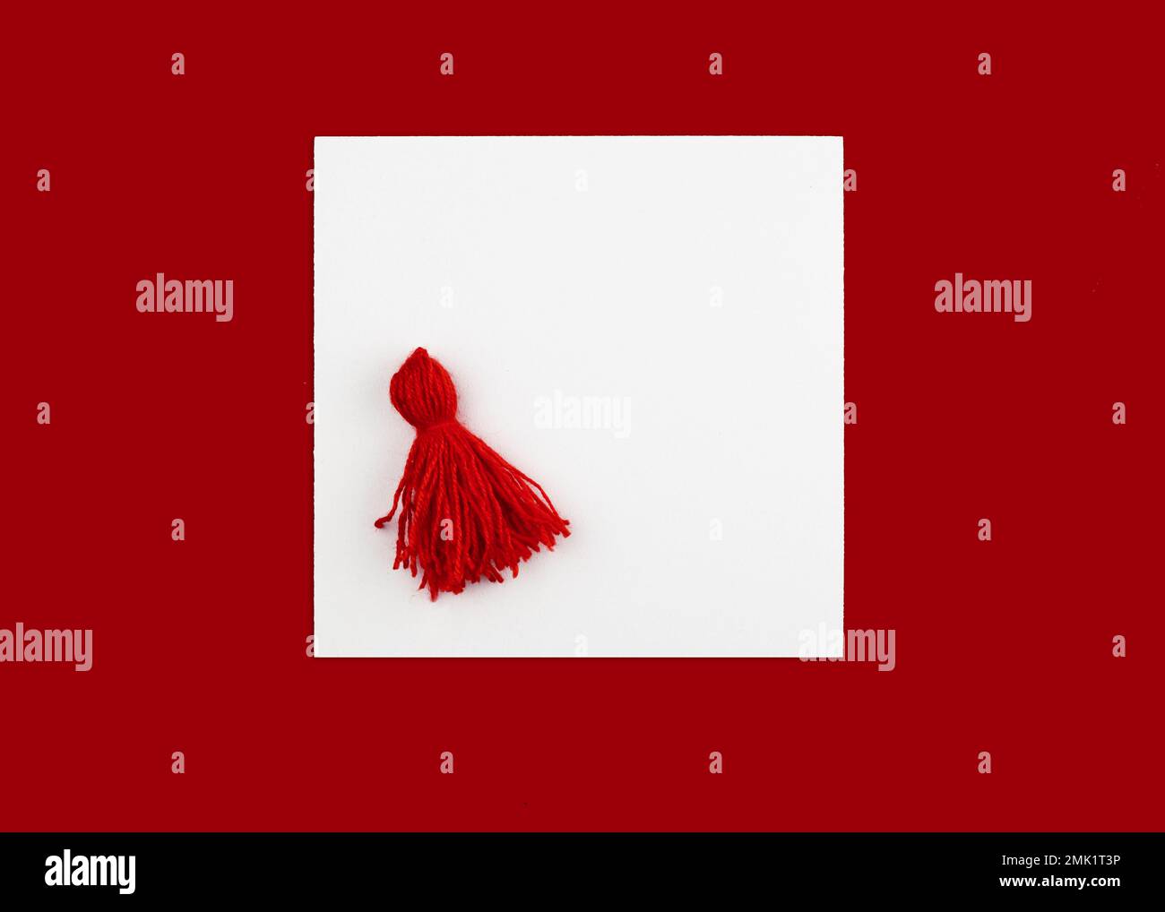 Red tassel Baba Marta symbol Martenitsa on white card. International ...