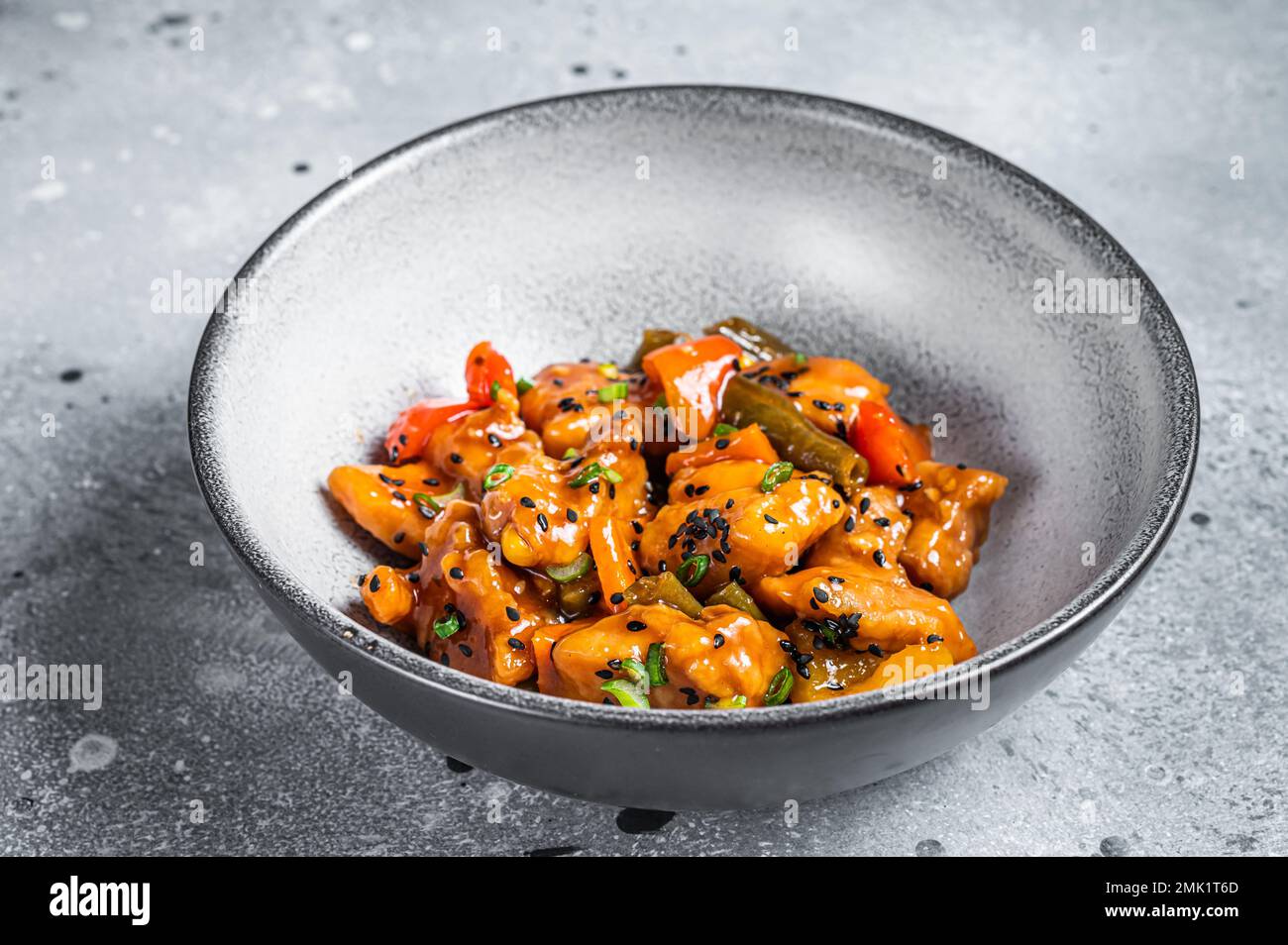 Chinese Sweet and Sour Pork guo bao rou in a bowl. Gray background. Top ...