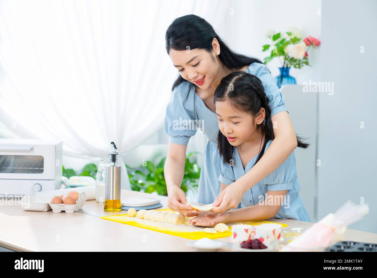My mother and daughter do baking together Stock Photo - Alamy