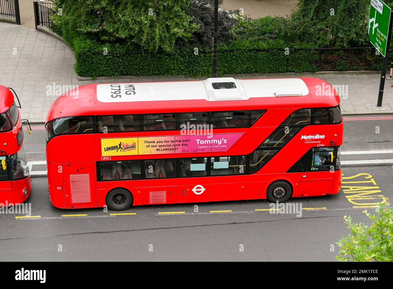 London, UK - August 2022: Red double decker bus on a road in central ...
