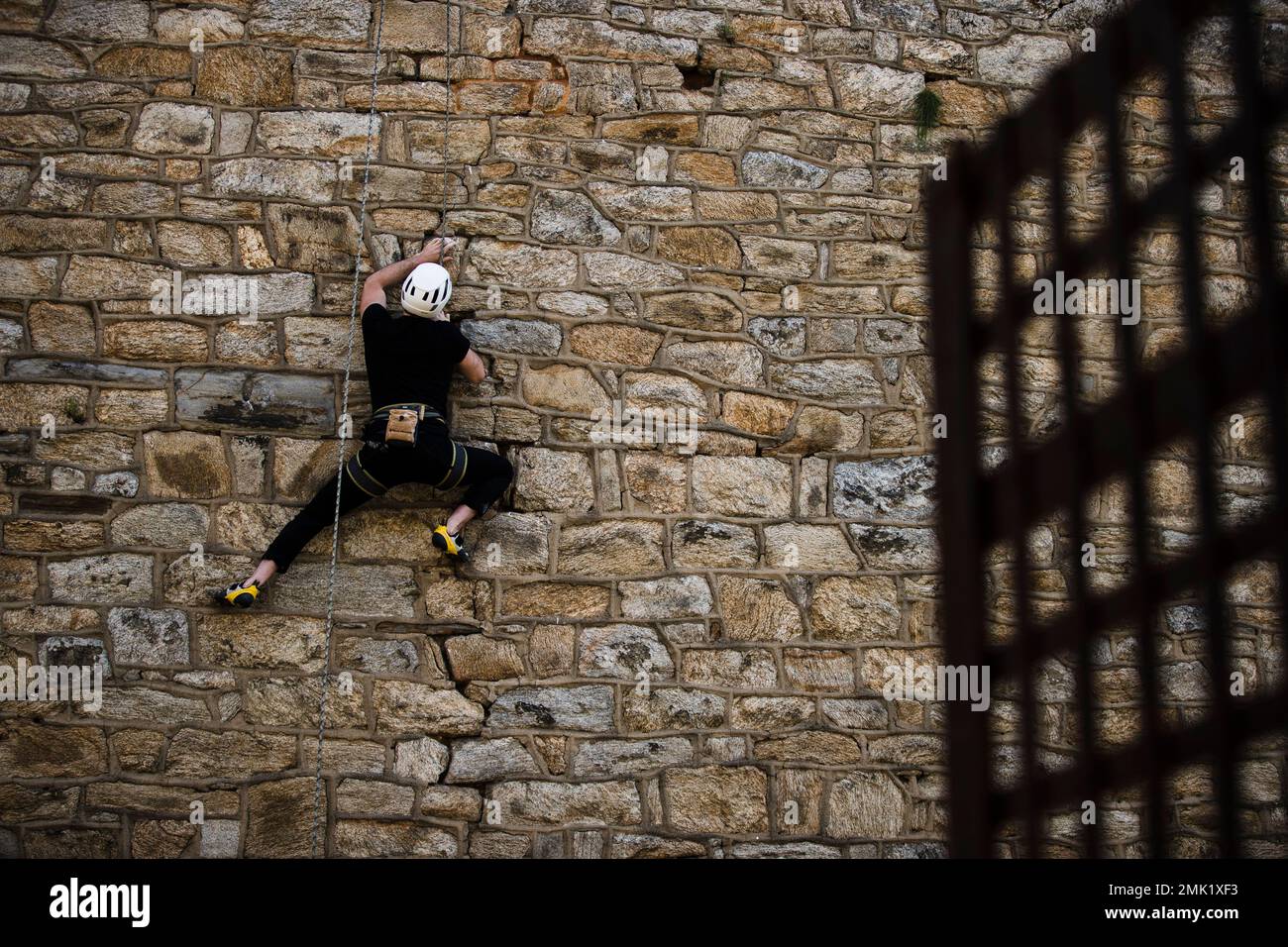 Artist Alexander Rosenberg scales a wall of the Eastern State ...