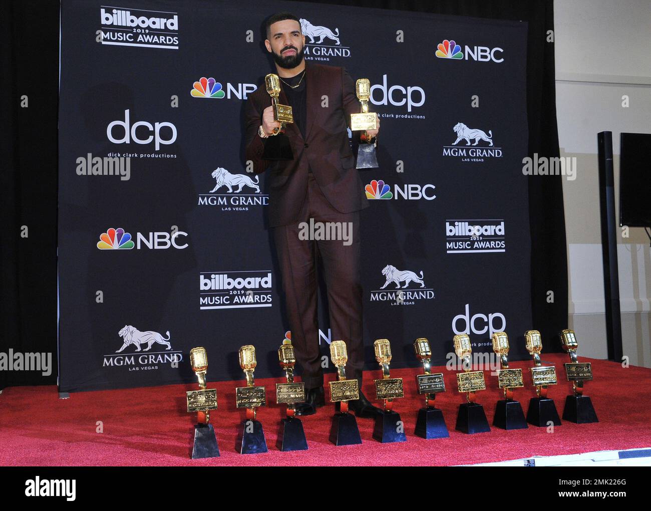 Drake poses in the press room with his awards at the Billboard Music ...