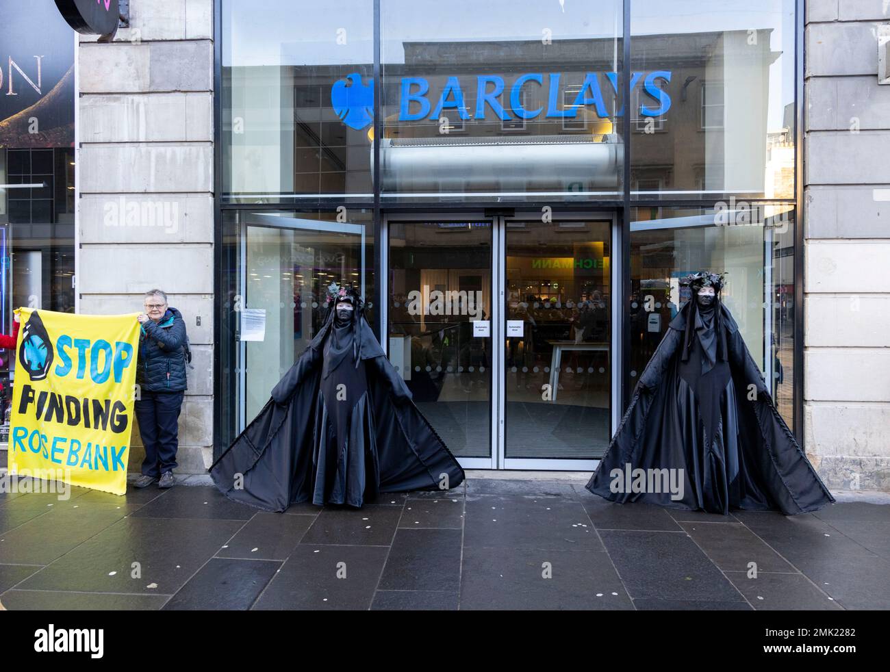 Extinction Rebellion Scotland activists protest outside a Barclays bank ...
