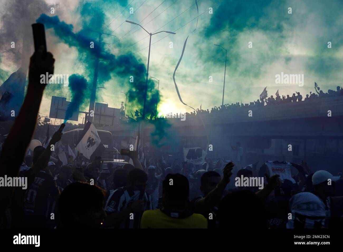 Monterrey fans are engulfed in blue smoke as they cheer on the arrival ...