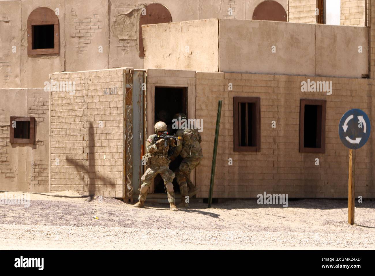 U.S. Army Soldier from 11th Armored Cavalry Regiment enter a building ...