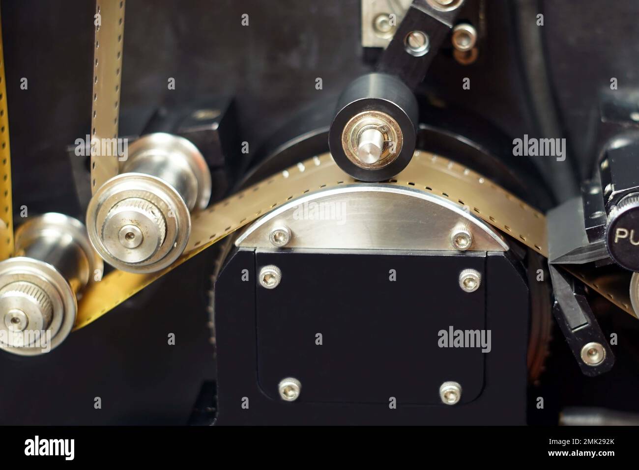 A black film on the yellow film on the sprocket of the picture head ...