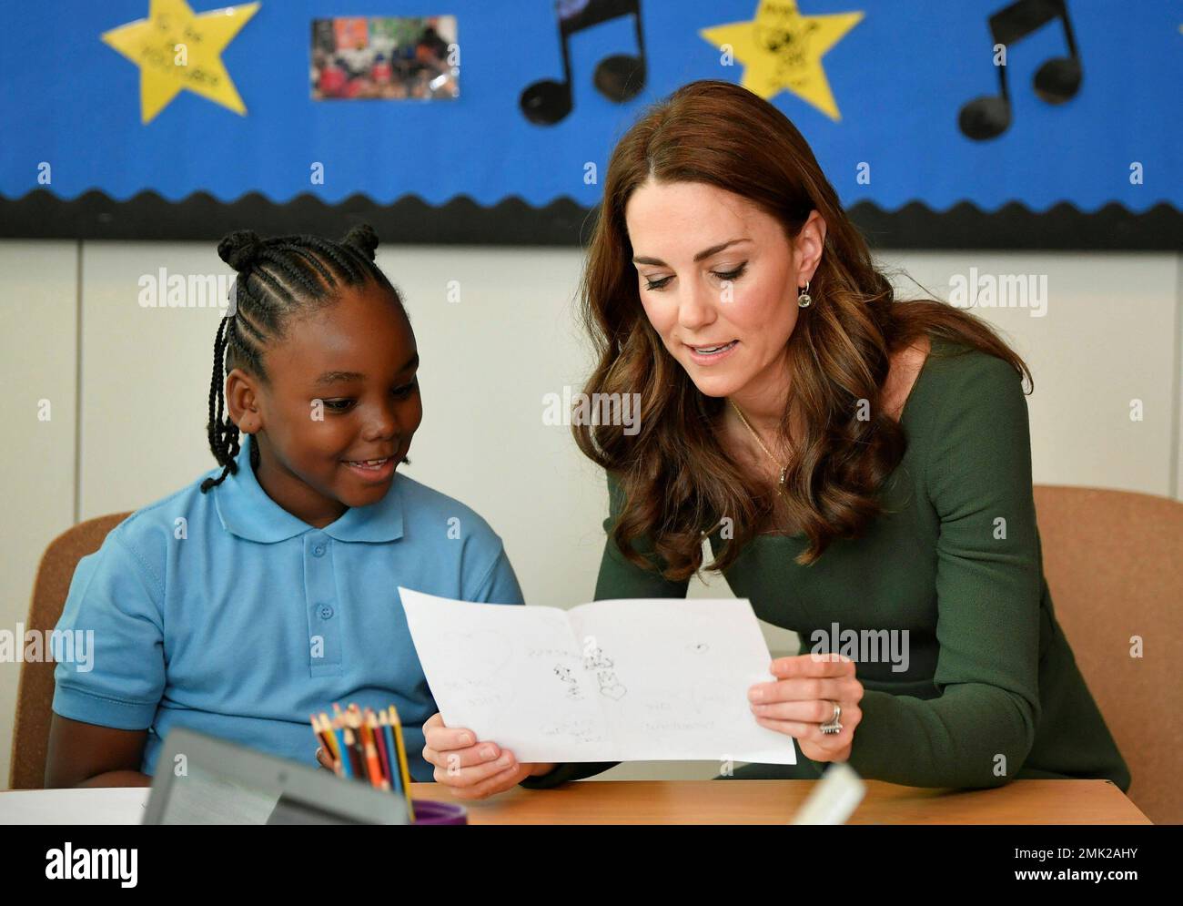 Britain's Kate, the Duchess of Cambridge interacts with a student ...
