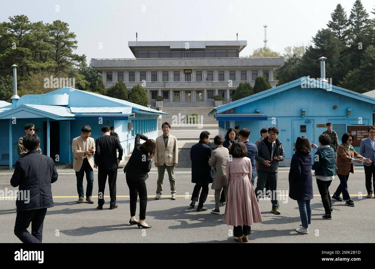 South Korean visitors take their souvenir photos at the southern side ...
