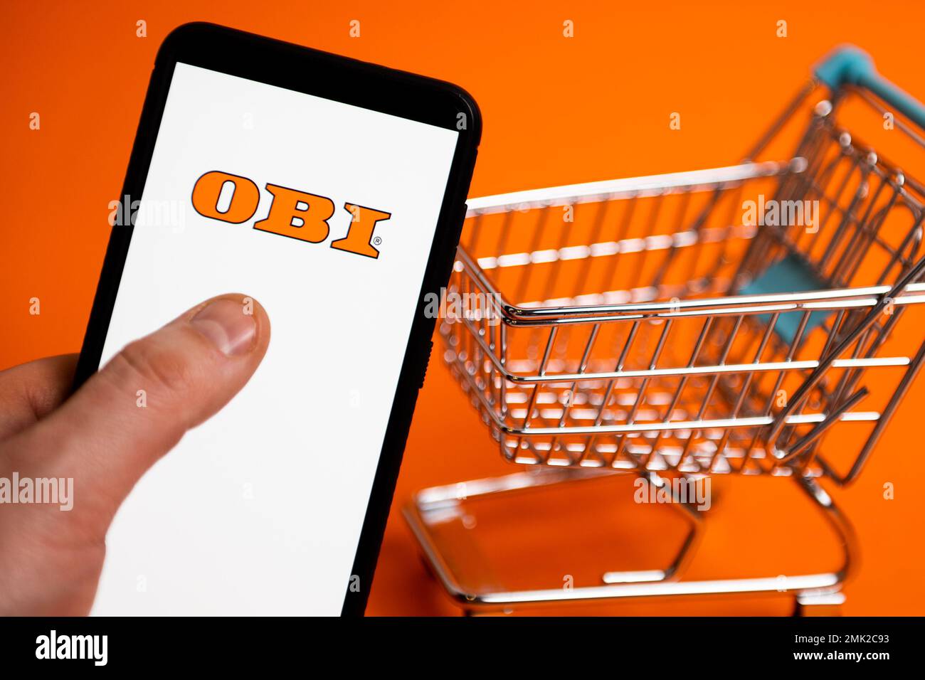 In this photo illustration an OBI logo seen displayed on a smartphone ...