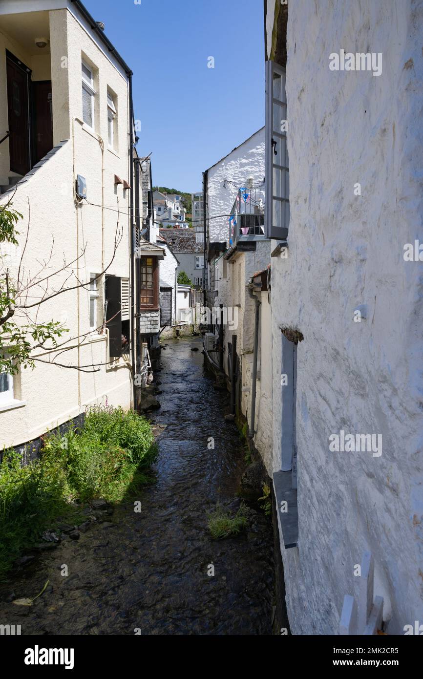 A stream running between houses Stock Photo - Alamy