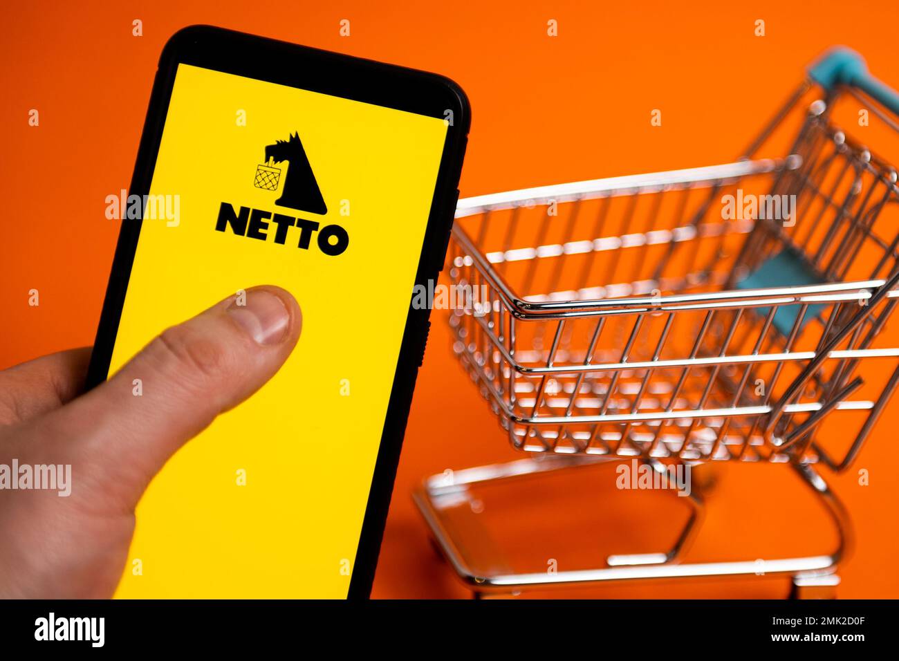 In this photo illustration a Netto logo seen displayed on a smartphone ...