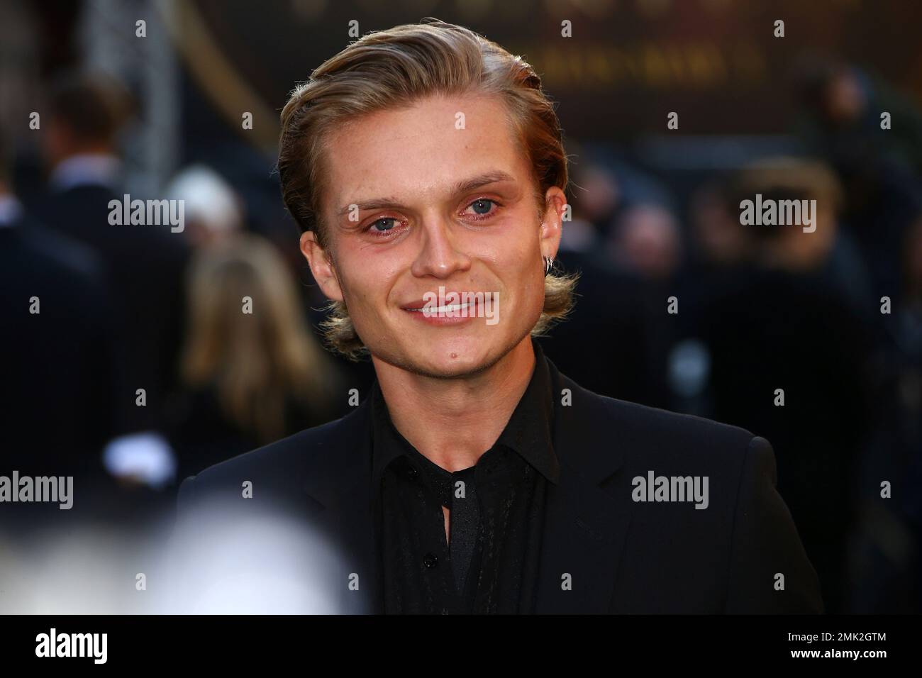 Actor Tom Glynn-Carney poses for photographers upon arrival at the ...