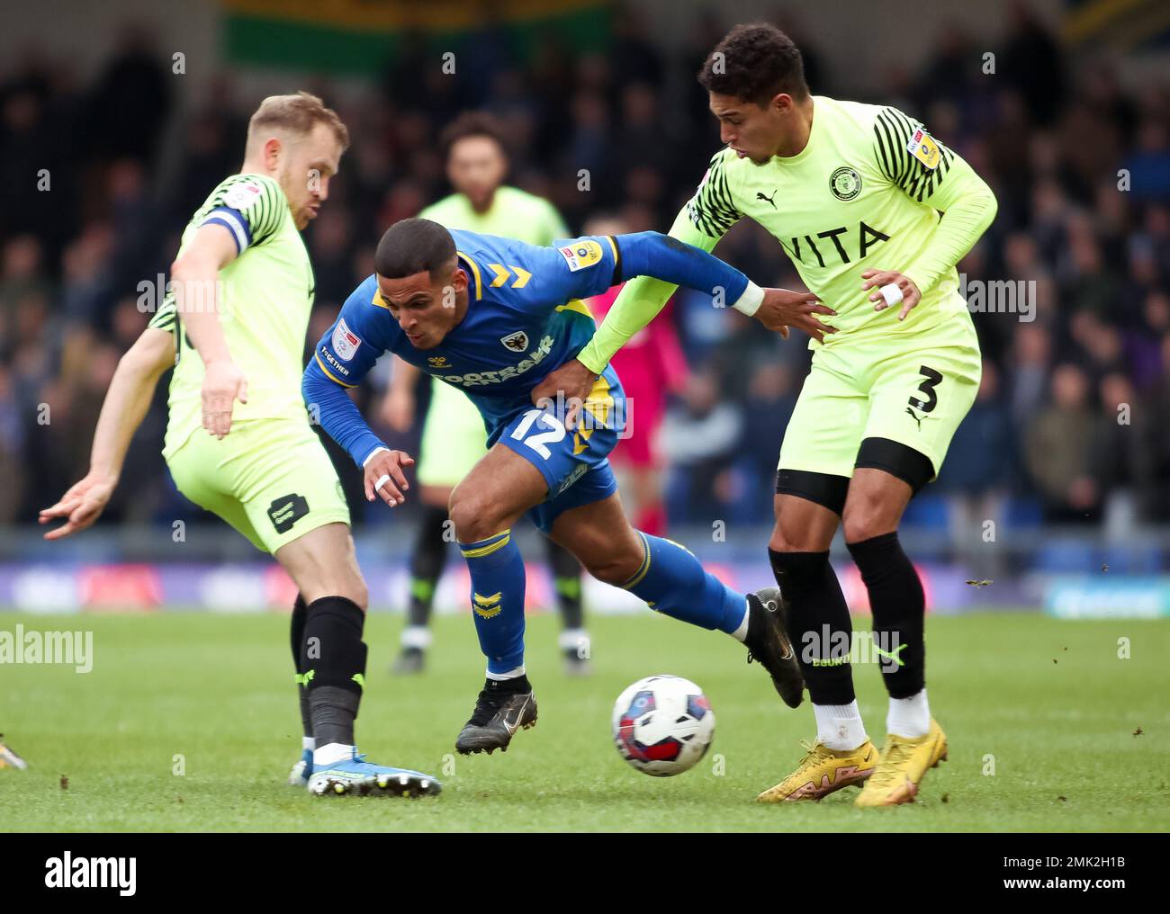 AFC Wimbledon's Ali Al-Hamadi and Stockport County's Kyle Knoyle battle ...
