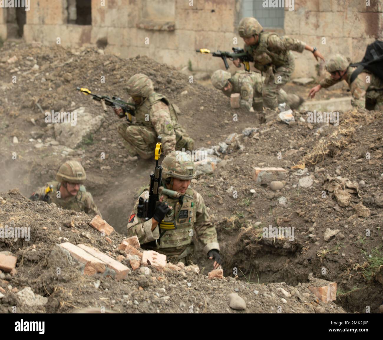 U.S. and British Army Soldiers tactically maneuver while conducting ...
