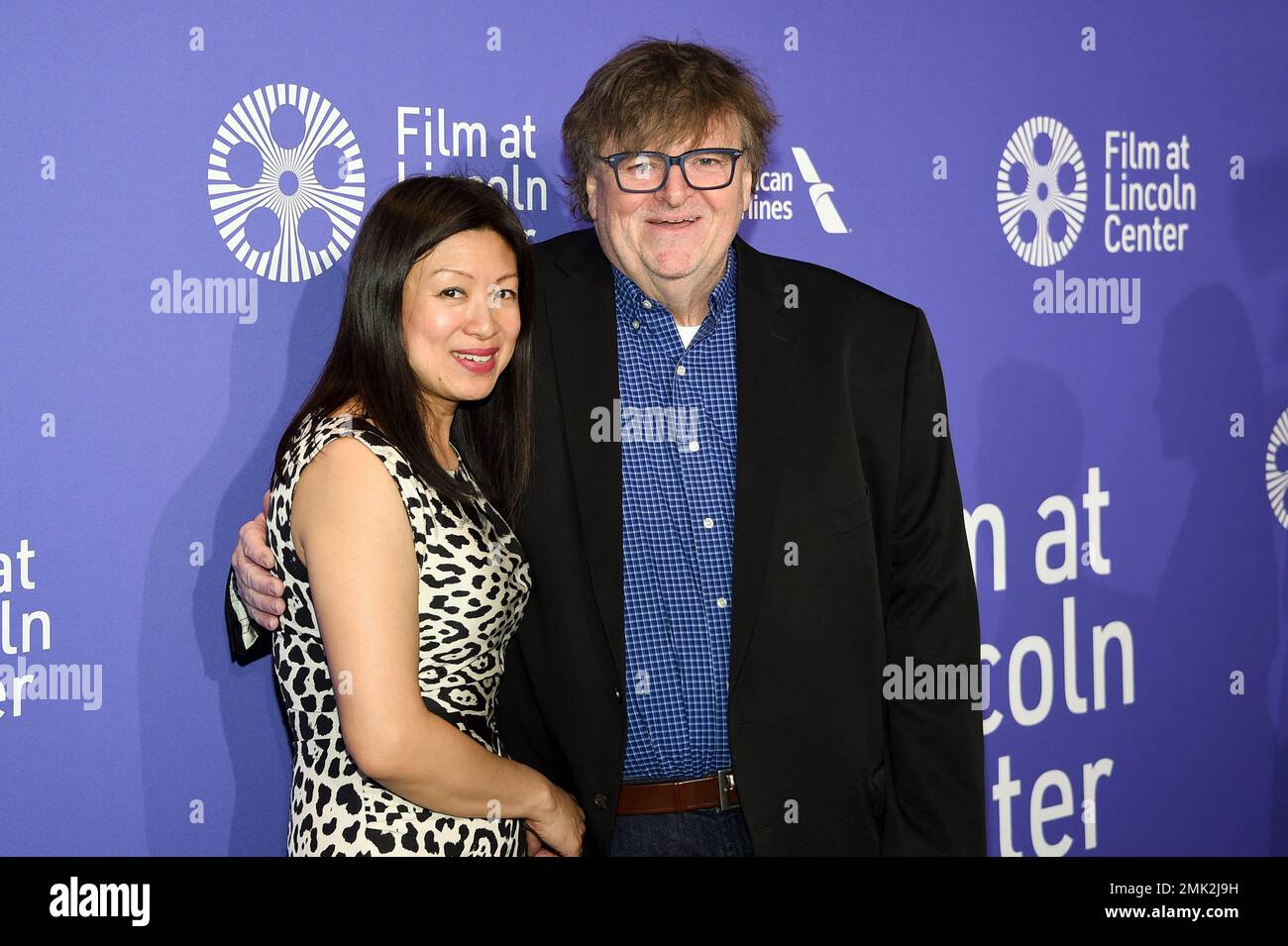 Filmmaker Michael Moore, right, and girlfriend Sonia Low attend the ...