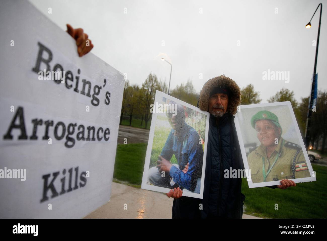 Protester Gene Stilp holds the photographs of victims in the Ethiopian ...