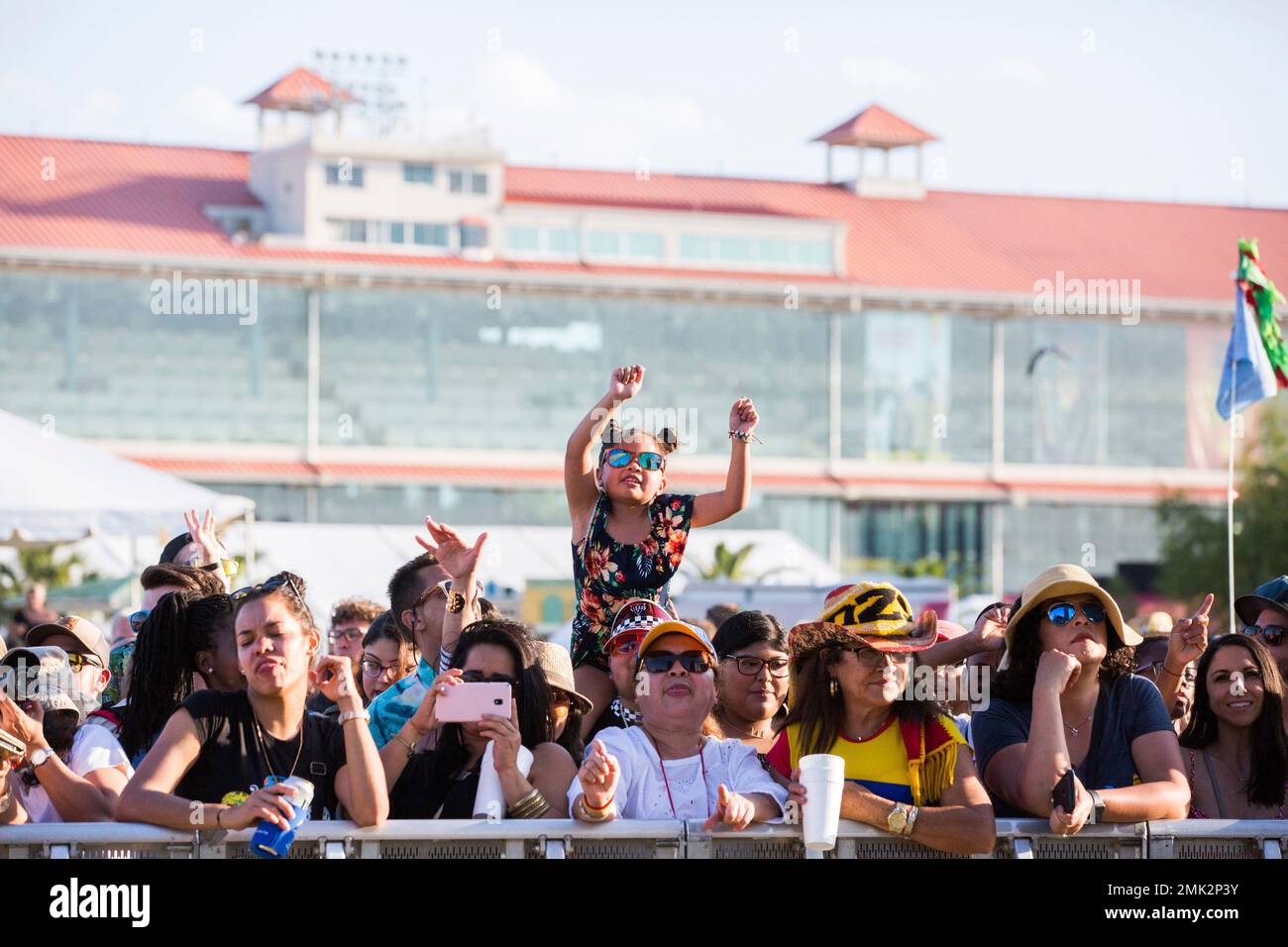 J Balvin fans sing along and dance as he performs on the Gentilly Stage ...