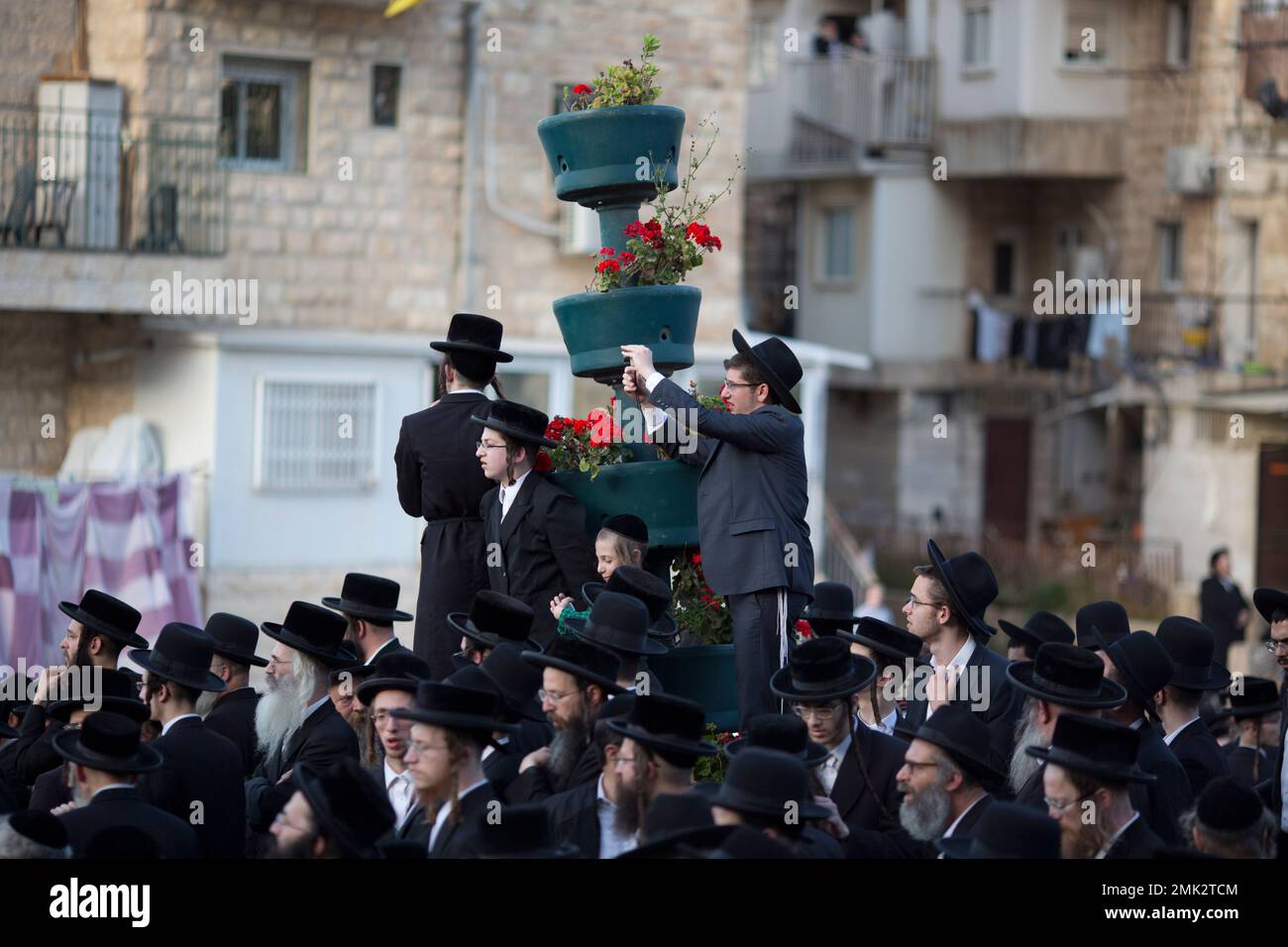 Ultra-Orthodox Jews watch the funeral procession of Rabbi of the Kaliv ...