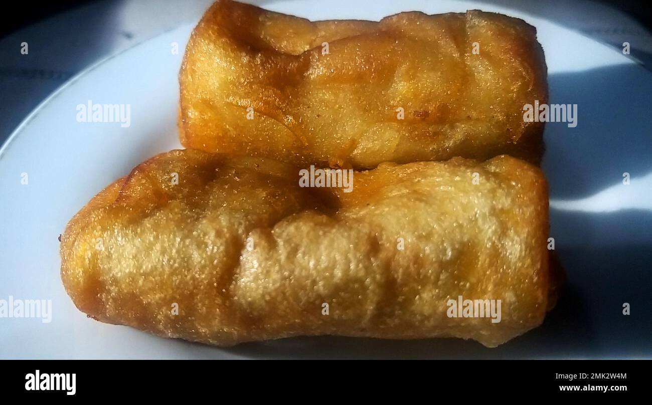 Close up photo of two risoles. a snack from Indonesia which is how it ...