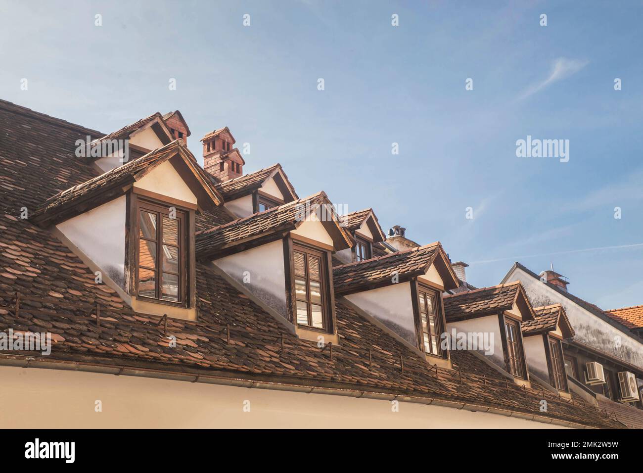 Old tiled roof with attics in Ljubljana Slovenia Stock Photo - Alamy