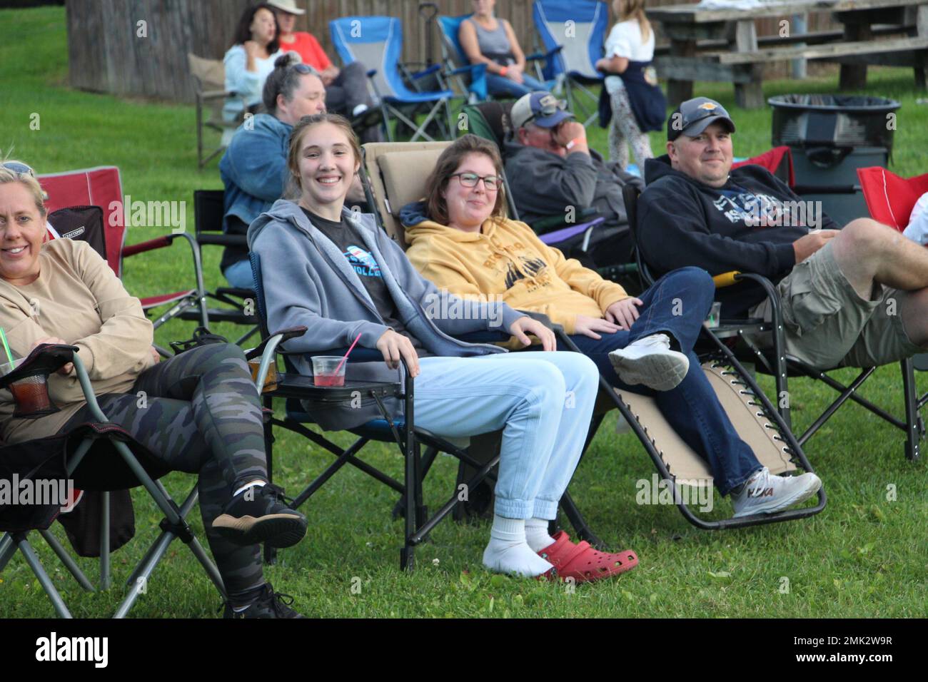 Concert-goers listen to performer Pearl Clarkin with the country duo ...