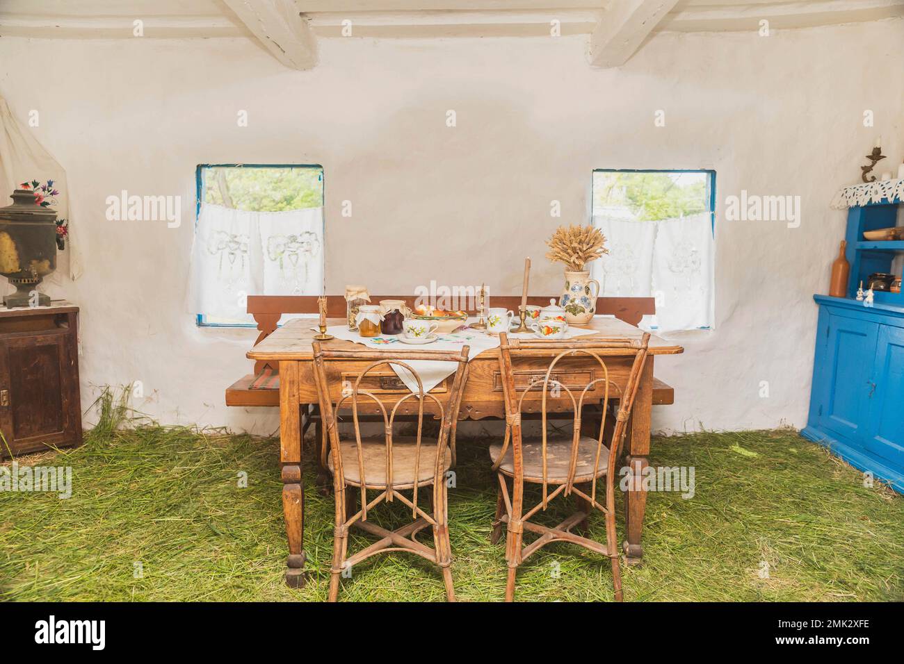 Table with tea and sweets in an old Ukrainian hut Stock Photo - Alamy