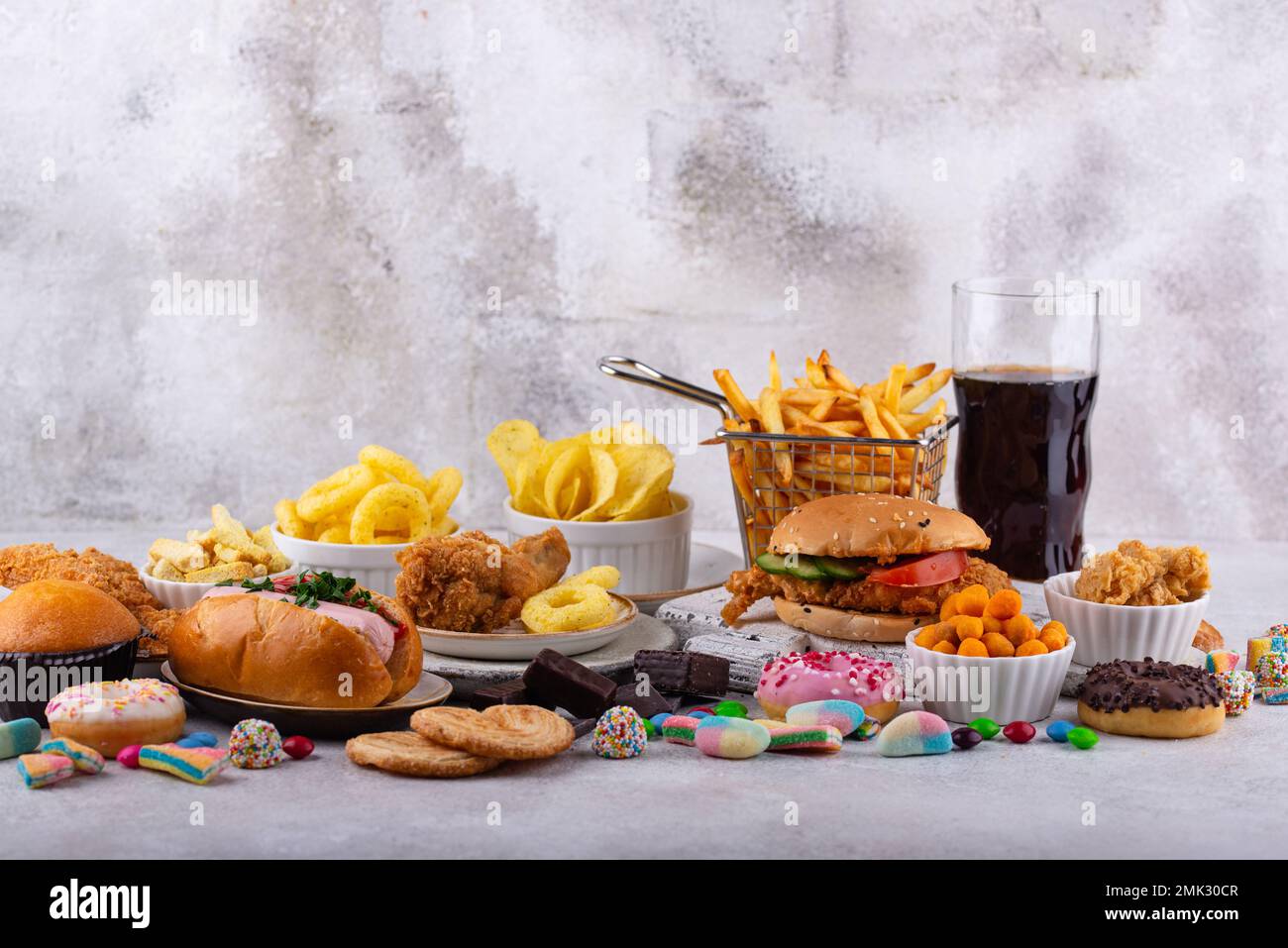 Assortment of various unhealthy junk food Stock Photo - Alamy