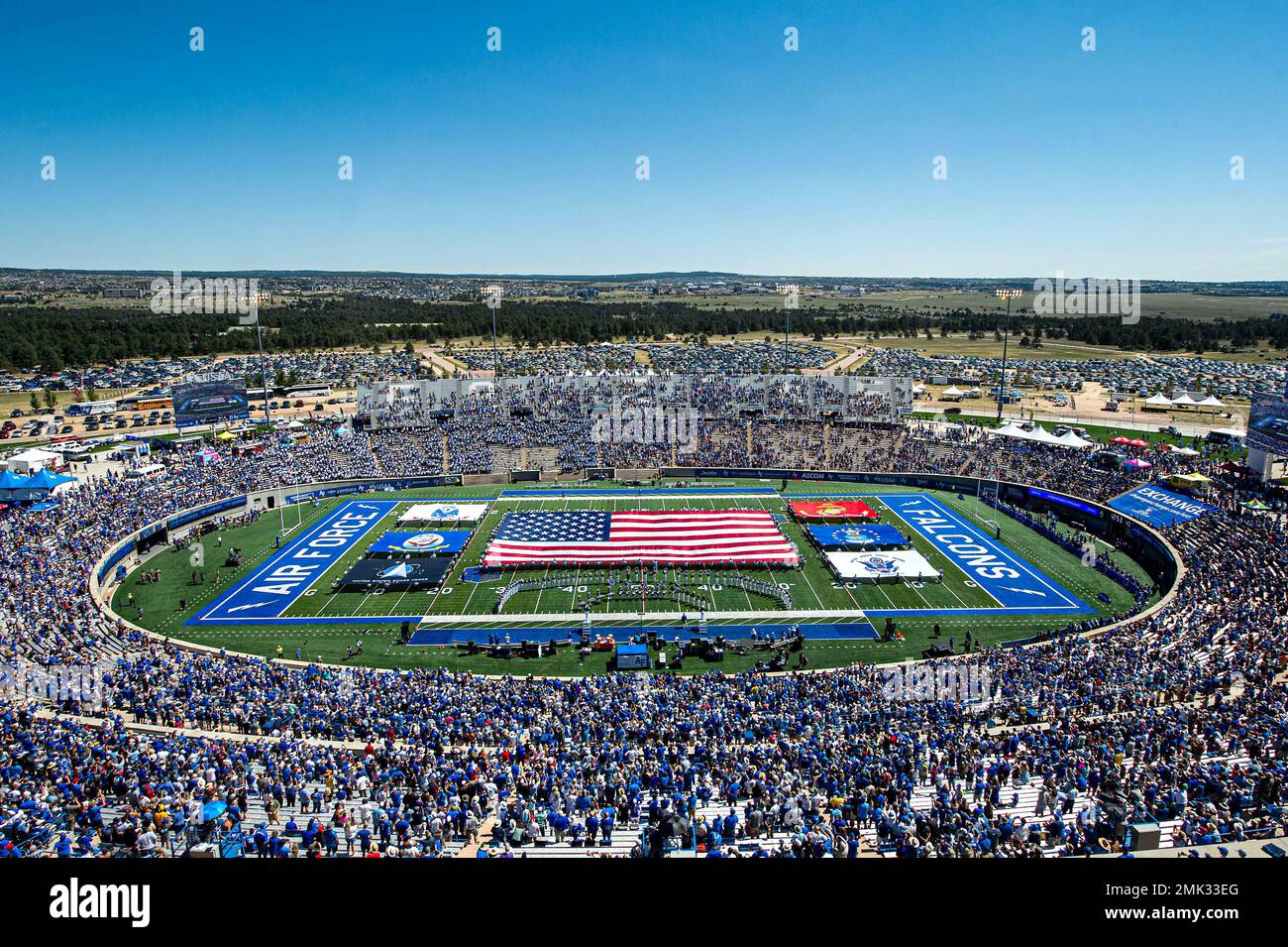 U.S. AIR FORCE ACADEMY, Colo. – Cadets extend flags across the field at ...