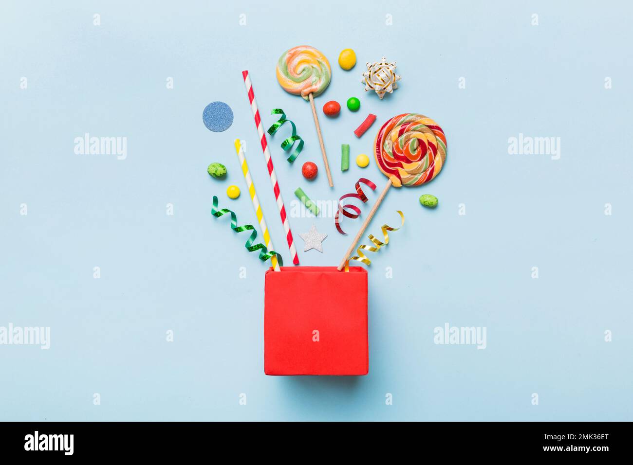 gift box in corner full of assorted traditional candies falling out on ...