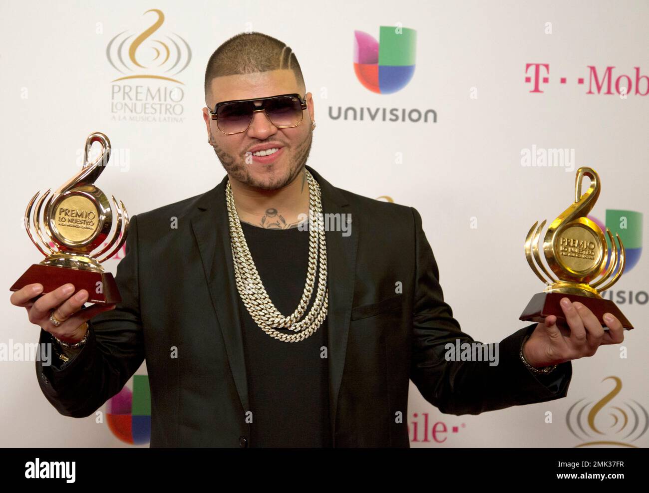 FILE - In this Feb. 19, 2015 file photo, Farruko poses for photos with ...