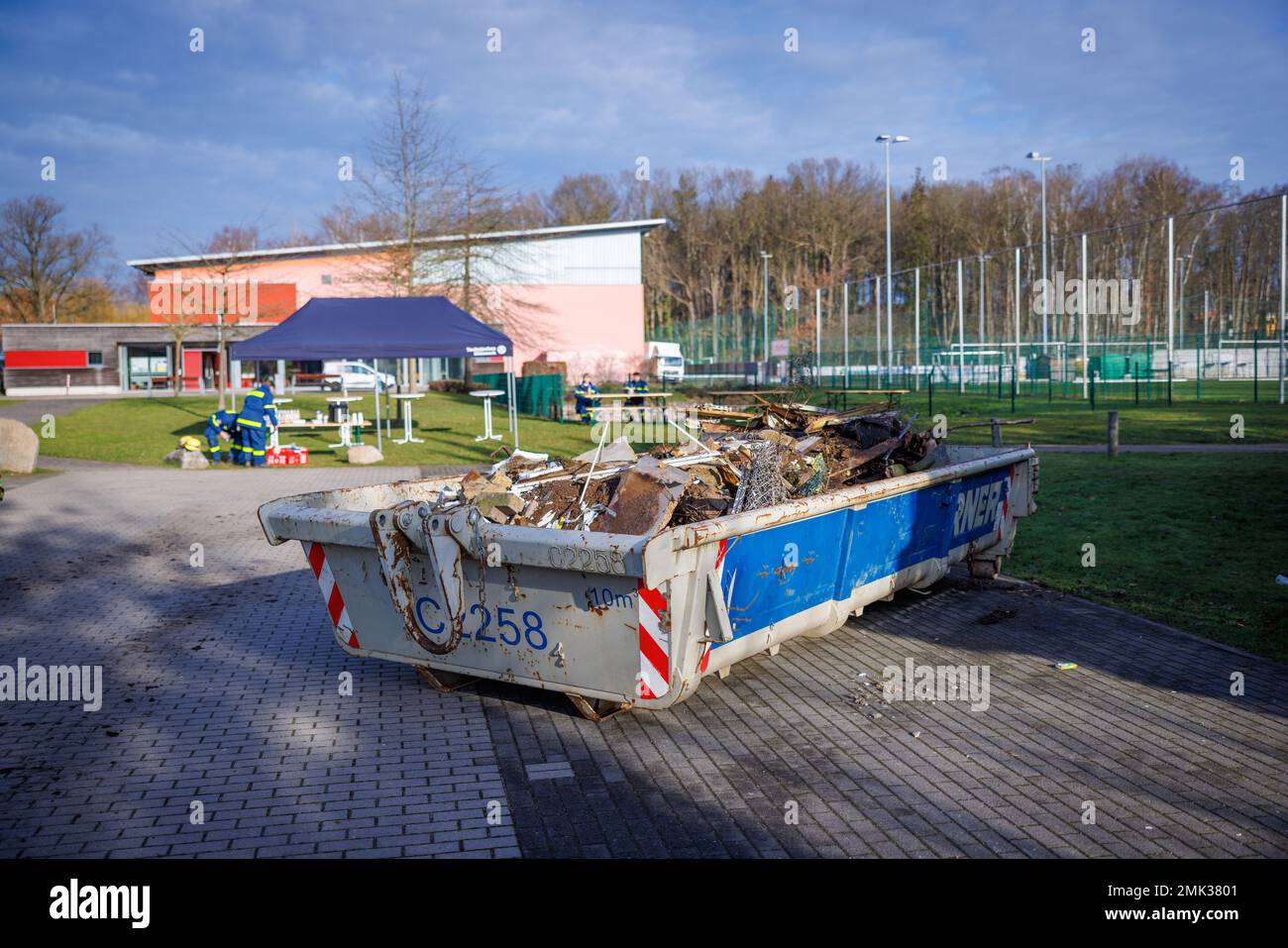 construction waste is disposed of in a large waste container Stock ...