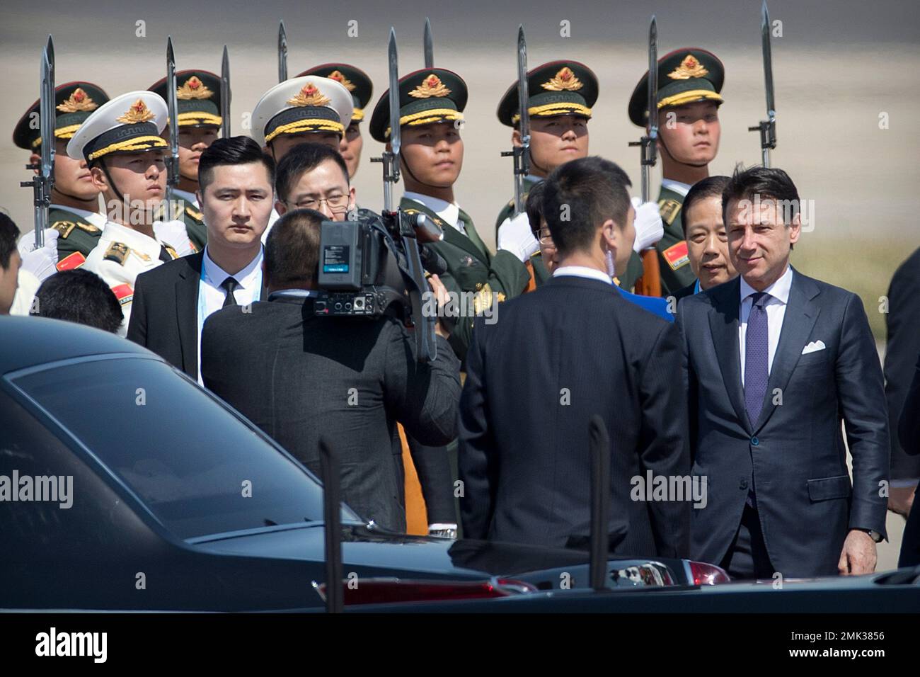 Italian Prime Minister Giuseppe Conte, right, arrives at Beijing ...