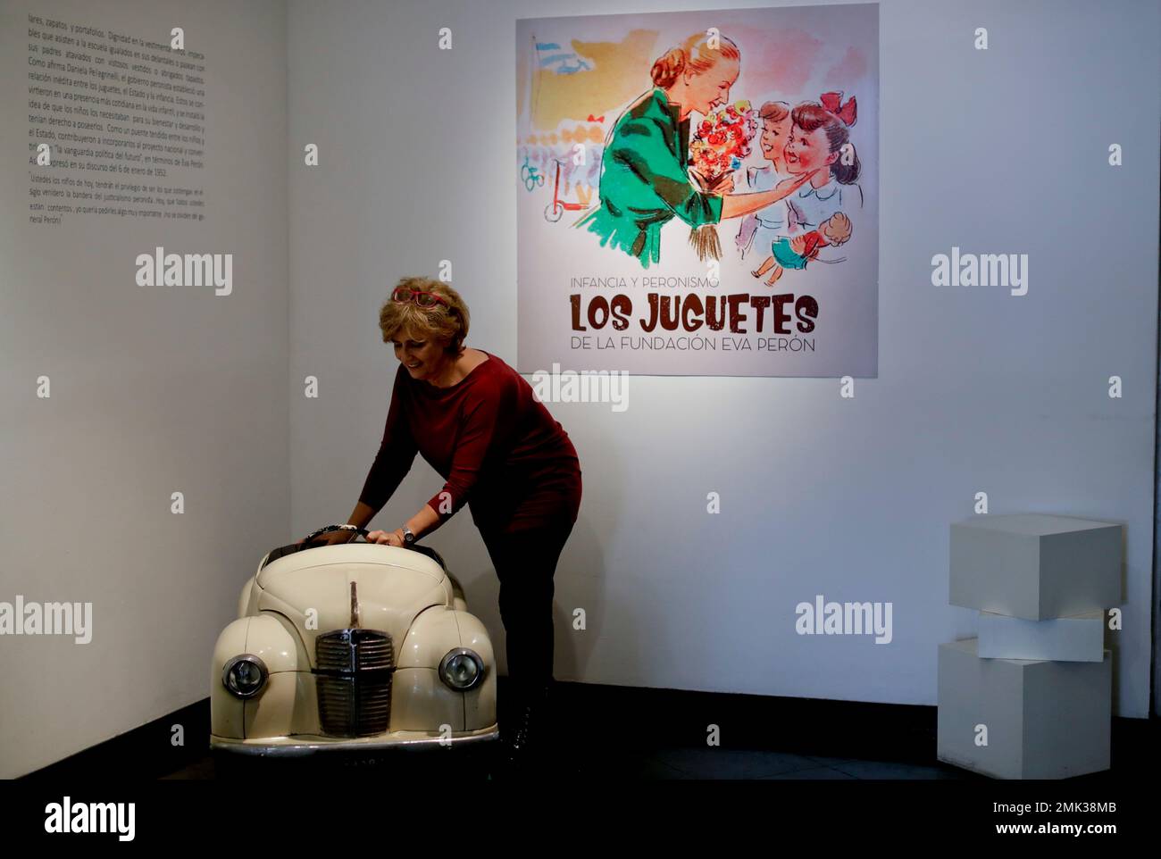 Marcela Genés, curator of the Evita museum, poses for a photo with a ...