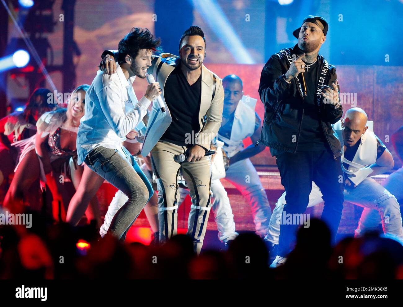 Sebastian Yatra, from left, Luis Fonsi and Nicky Jam perform "Date La ...
